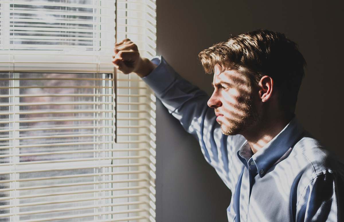 People Person Near Clear Glass Window Pane And Window Blinds Low Light Photography Human Image